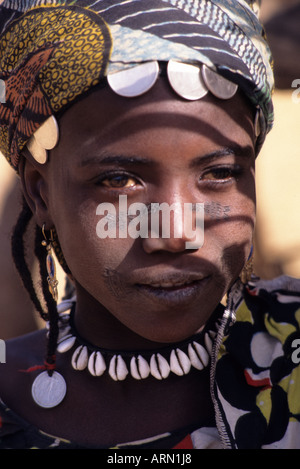 Young Nigerien Woman with Facial Scarification and Nose Pin, Carrying ...
