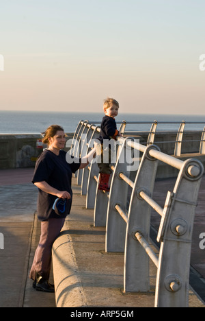 Child climbing railings childs - play Stock Photo - Alamy