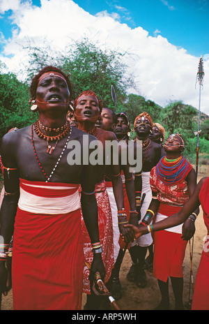 Samburu moran or warriors and girls dancing in traditional dress ...