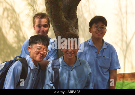 group of school boys relaxing in the sun Stock Photo - Alamy