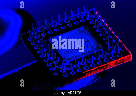 tiny computer processor chip balanced on tip of human finger Stock ...