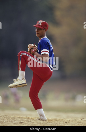 Teen baseball boy pitcher in the middle of a pitch Stock Photo - Alamy