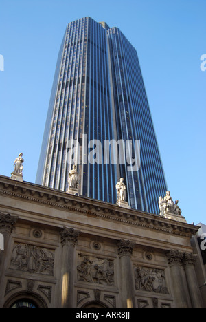 Tower 42 tall skyscraper commercial office building against blue sky ...