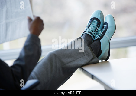Unrecognizable man resting feet up sitting on the car Stock Photo - Alamy