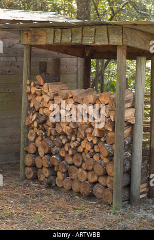 Firewood pile stacked chopped wood trunks, close-up wooden background ...