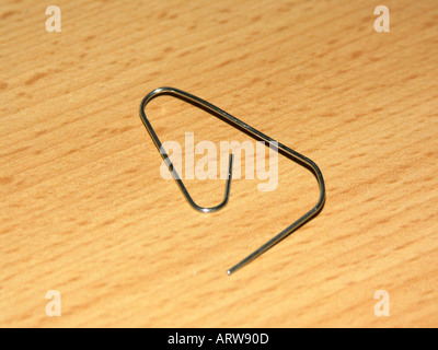 Bent Paperclip on Desk Stock Photo - Alamy