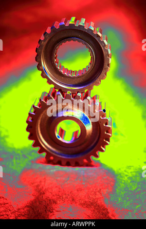 Two gears meshing together Stock Photo - Alamy