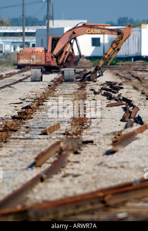 Industrial crane rips out railroad train tracks where new building ...