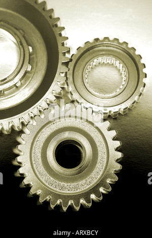 Three cog wheels working together in an engine Stock Photo - Alamy
