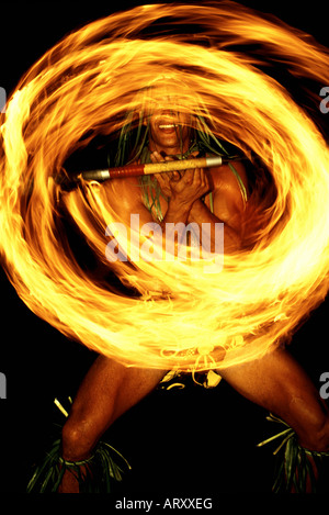 Spectacular Polynesian fire dancer entertains tourists at a luau on the ...