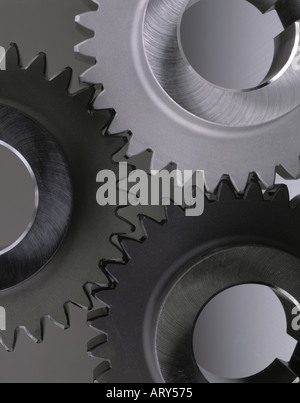Three metal cog gears together Stock Photo - Alamy