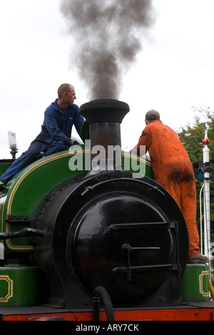 Steam locomotive stopped for water refill Stock Photo - Alamy