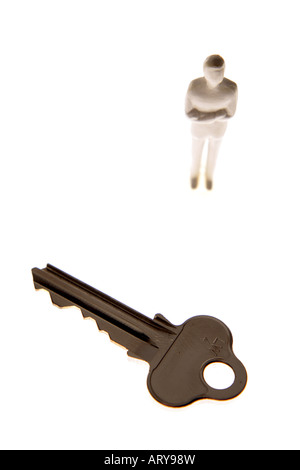 Key and figure on white Stock Photo - Alamy