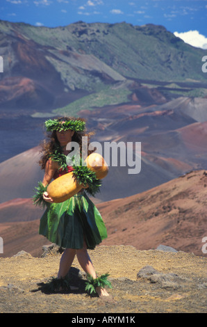 Native woman dancing hula with ipu (gourd) at Haleakala crater, island ...