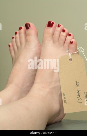 womans feet and toes with name number label Stock Photo - Alamy