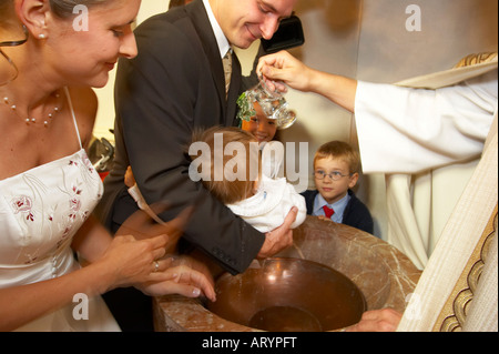 Church ceremony, baptism of young children. Parents, Grandparents ...