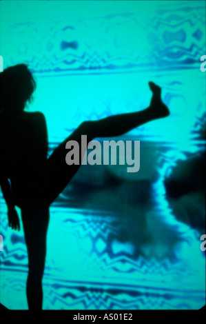 shadow of a dancer with coloured light around James Bond style Stock ...