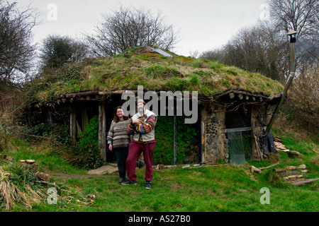 Tony Wrench and his partner Jane Faith with the roundhouse they built ...