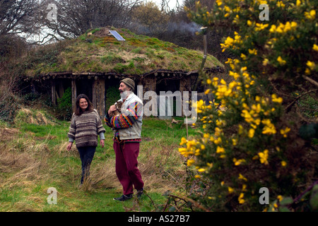 Tony Wrench and his partner Jane Faith with the roundhouse they built ...
