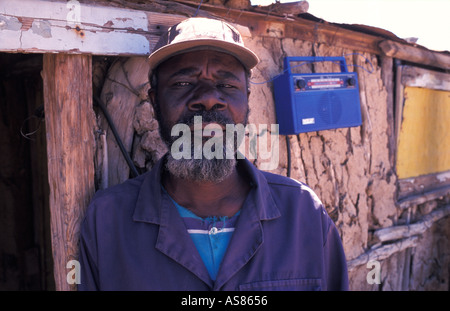 Damara man outside his home Brandberg hills area near Uis Namibia Stock ...