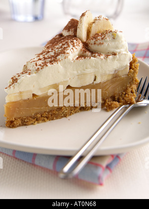 Banoffee cake with bananas and whipped cream in cafe restaurant, stock ...