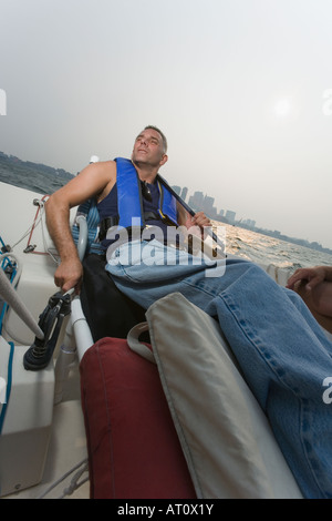 Man with handicap doing disability boat sailing Stock Photo - Alamy