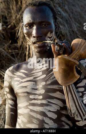 Karo man with body painting made from mixing animal pigments with clay ...