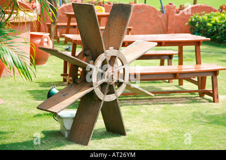 Wooden benches on a lawn in resting picnic area on the shore of a fjord ...