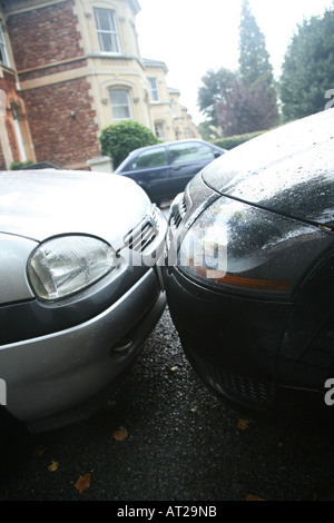 Two cars badly parked bumper to bumper - France Stock Photo - Alamy