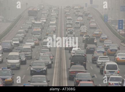 Heavy urban traffic jam on a city street with lines of passenger cars ...