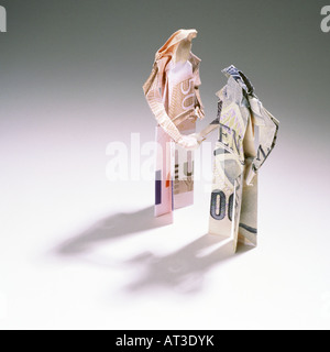 Two origami men made from euro notes Stock Photo - Alamy
