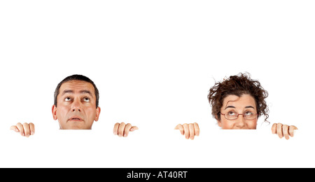 Business man and woman appearing behind the blank poster Stock Photo ...