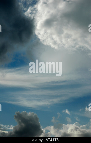 grey black cloud in a blue sky Stock Photo - Alamy