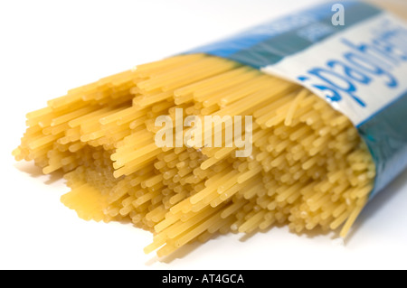 Pasta spilling out of a packet Stock Photo - Alamy