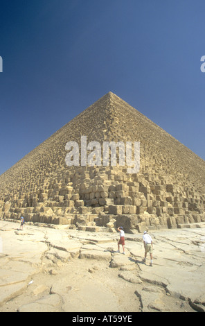 Breathtaking view of the iconic pyramids of Giza under a partly cloudy ...