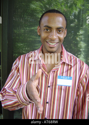 Smiling african ethnicity man wearing a sports tank top, standing with ...