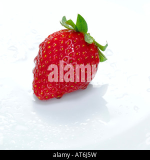 One ripe strawberry without green leaves isolated on white background ...