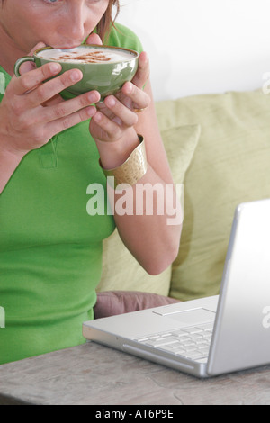 Woman drinking coffe Stock Photo - Alamy