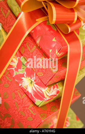 Christmas presents wrapped in colorful wrapping paper under Christmas ...