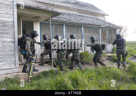 SWAT training. Moving in formation approaching a building Stock Photo ...