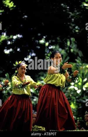 Close-up of female hula dancer's feet with purple ankle leis, during a ...