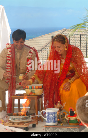 Tradditional Hindi wedding with groom wearing carnation flowers and ...