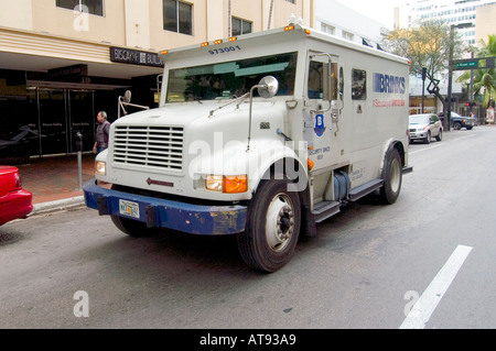 Brinks Armored Truck picks up and delivers cash money to banks and ...