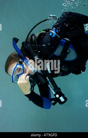 Scuba diver descending Stock Photo - Alamy