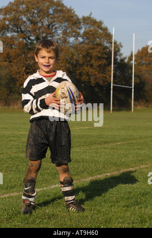 Young boy rugby player with muddy face and mouthguard, Berkshire ...