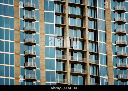 Urban building exterior with windows and balcony Stock Photo - Alamy