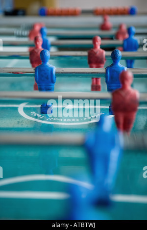 Red and blue players from table top football game, to emphasise ...