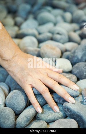 Woman hand touching stone. Sensation from stroking tough material ...