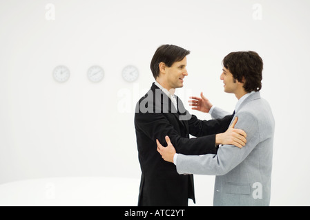Businessmen with their hands on each other's shoulders Stock Photo - Alamy