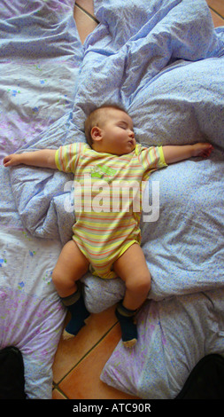 baby sleeeping with outstretched arms Stock Photo - Alamy